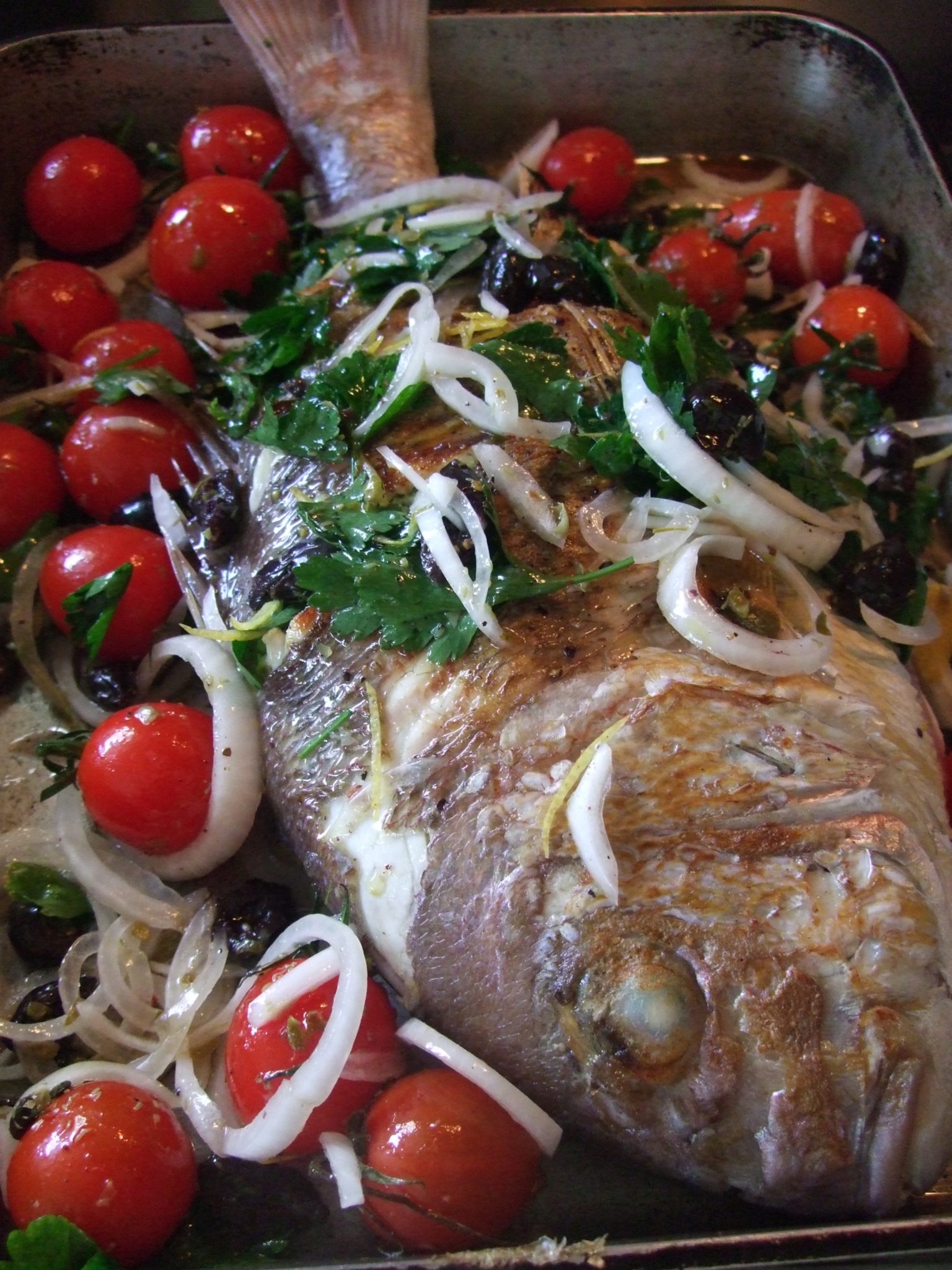 Whole Baked Fish Tomato, Lemon, Basil and Olive Sauce